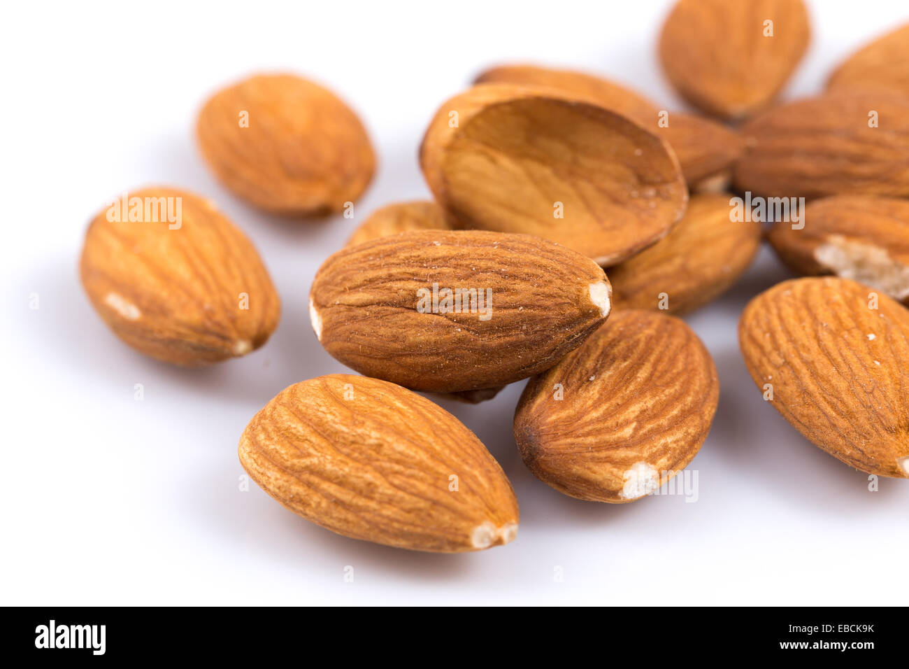 Composition from almond nuts isolated on white background Stock Photo ...