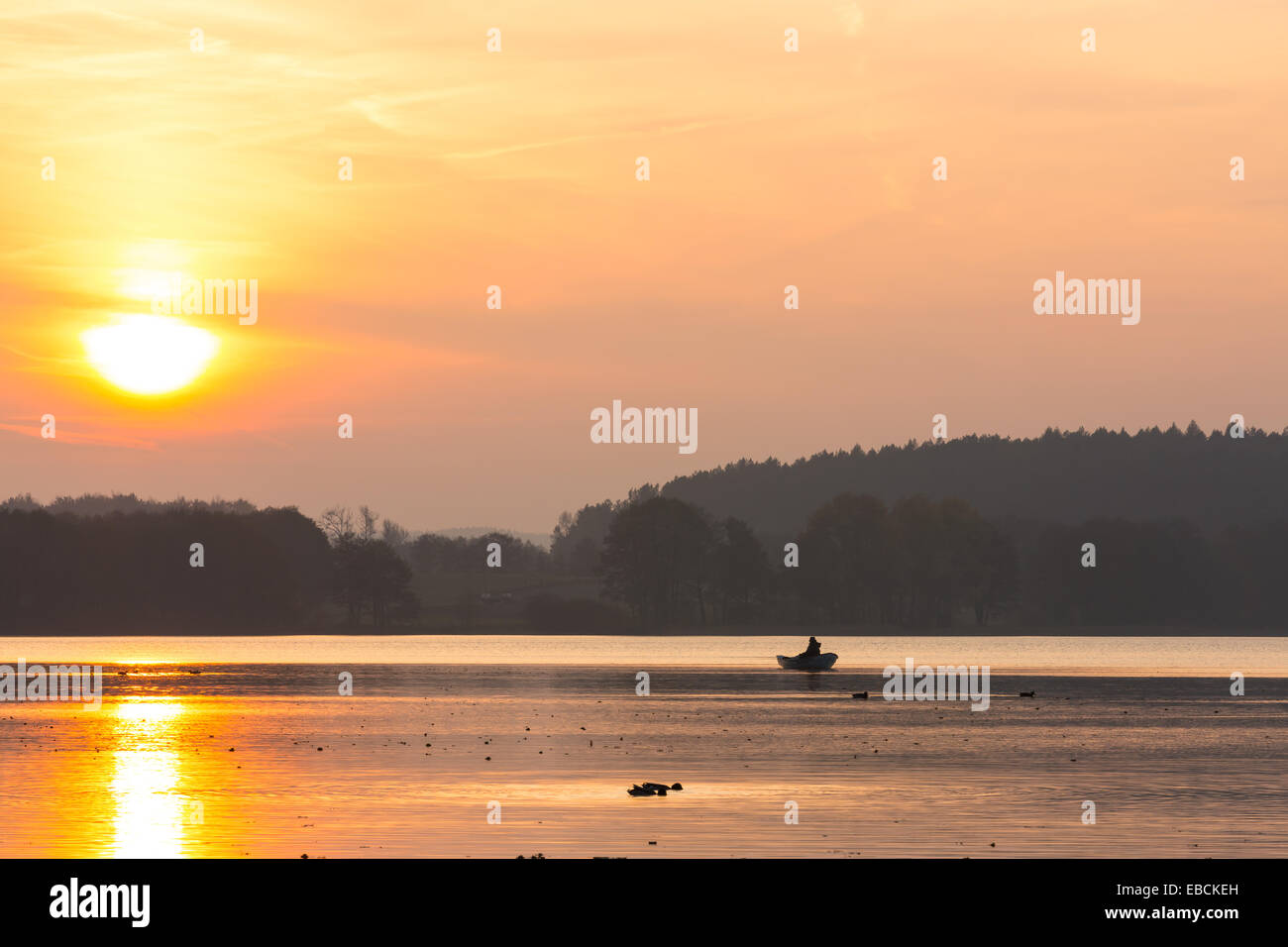 Boat on lake at sunset hi-res stock photography and images - Alamy