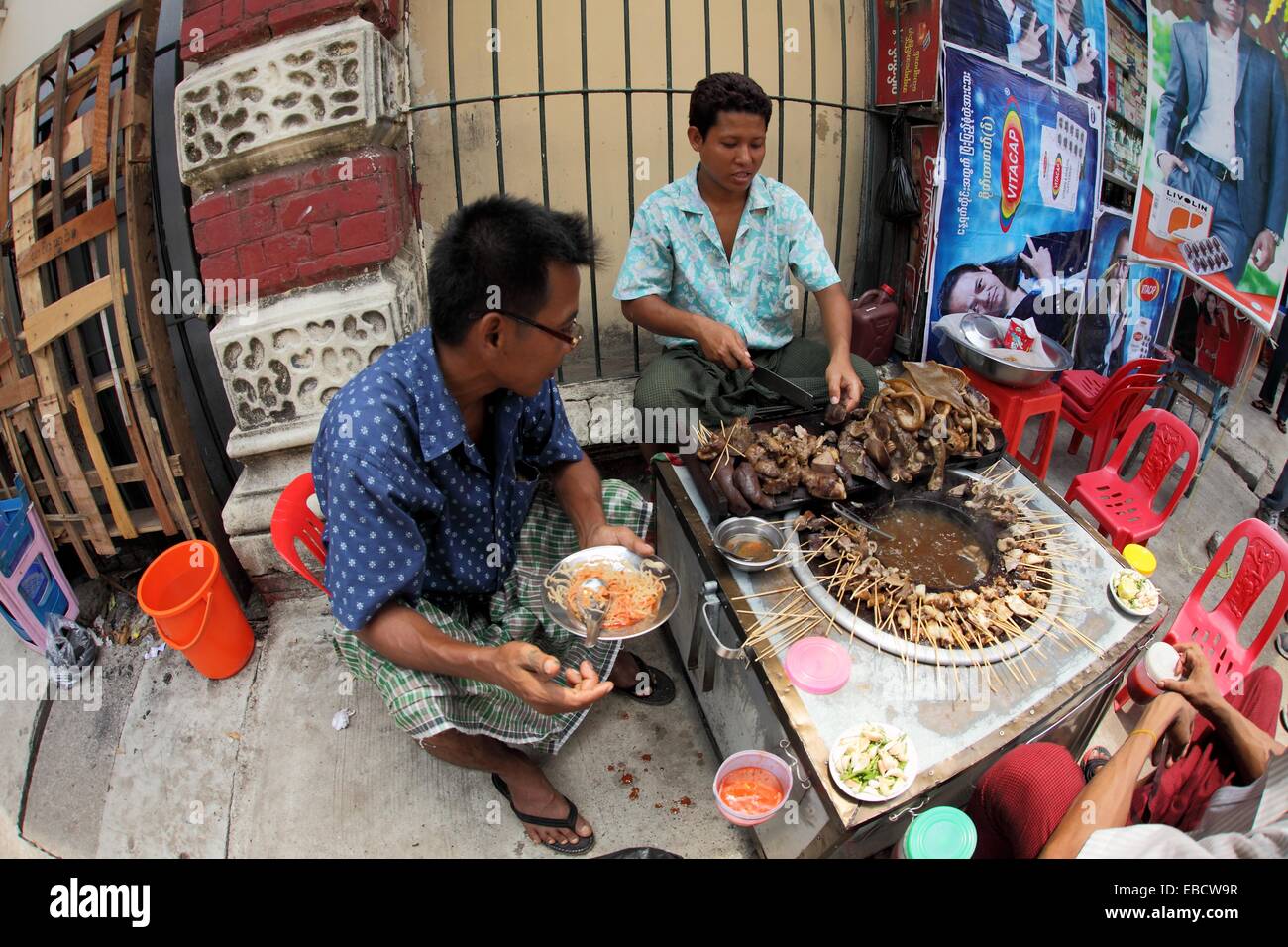 Myanmar young man eating hi-res stock photography and images - Alamy