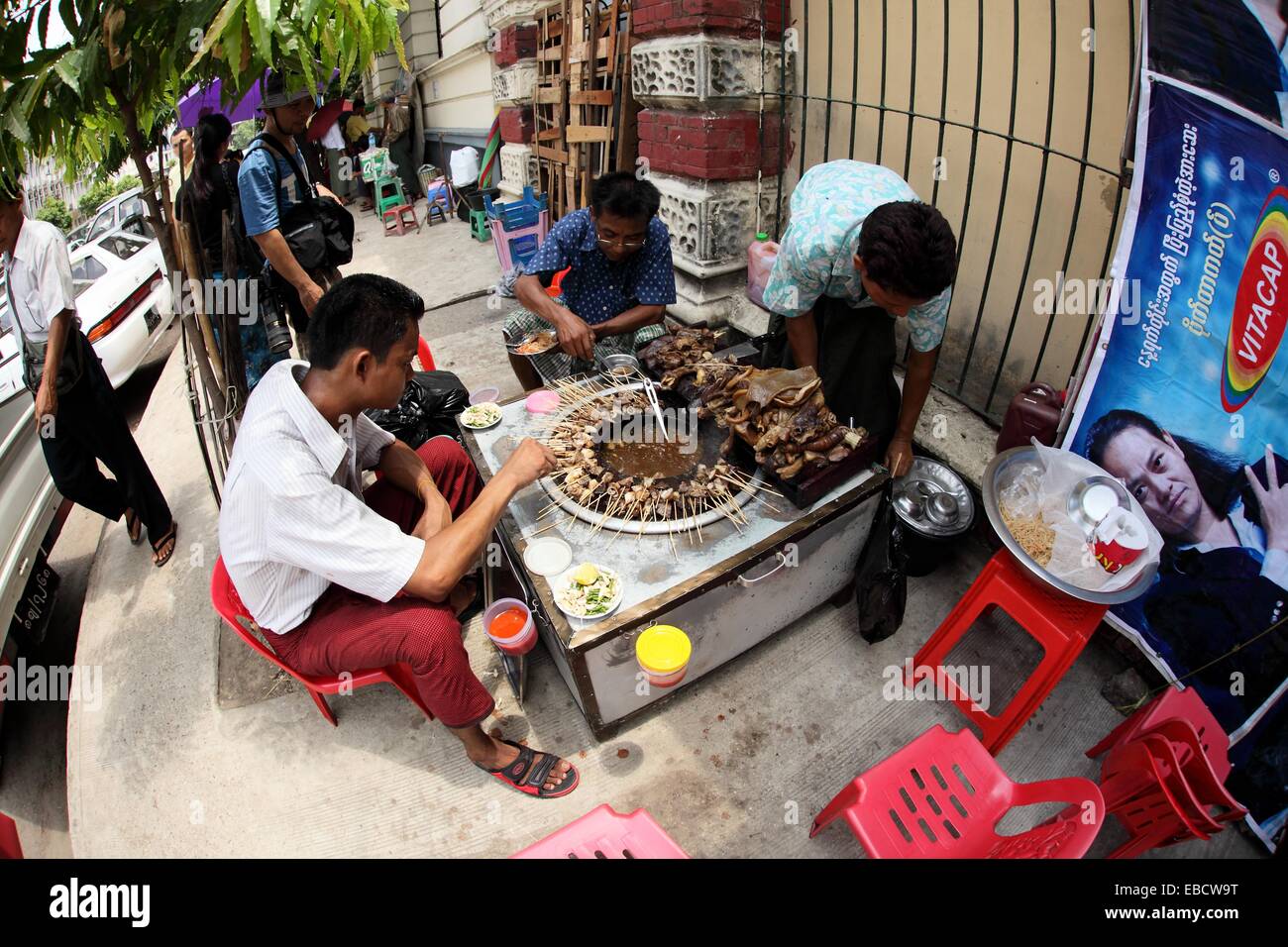 Myanmar young man eating hi-res stock photography and images - Alamy