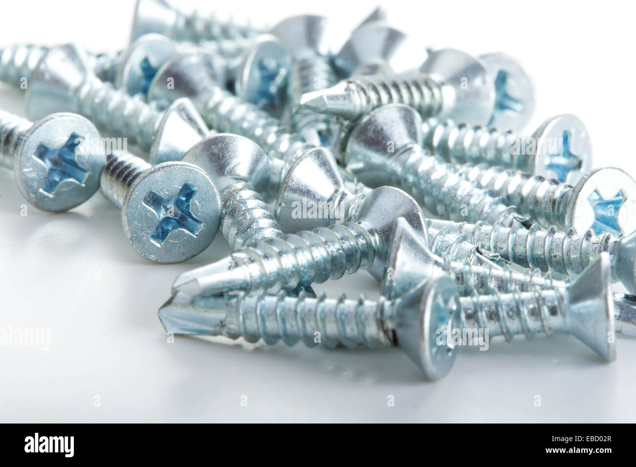Metal screws isolated on white background Stock Photo - Alamy