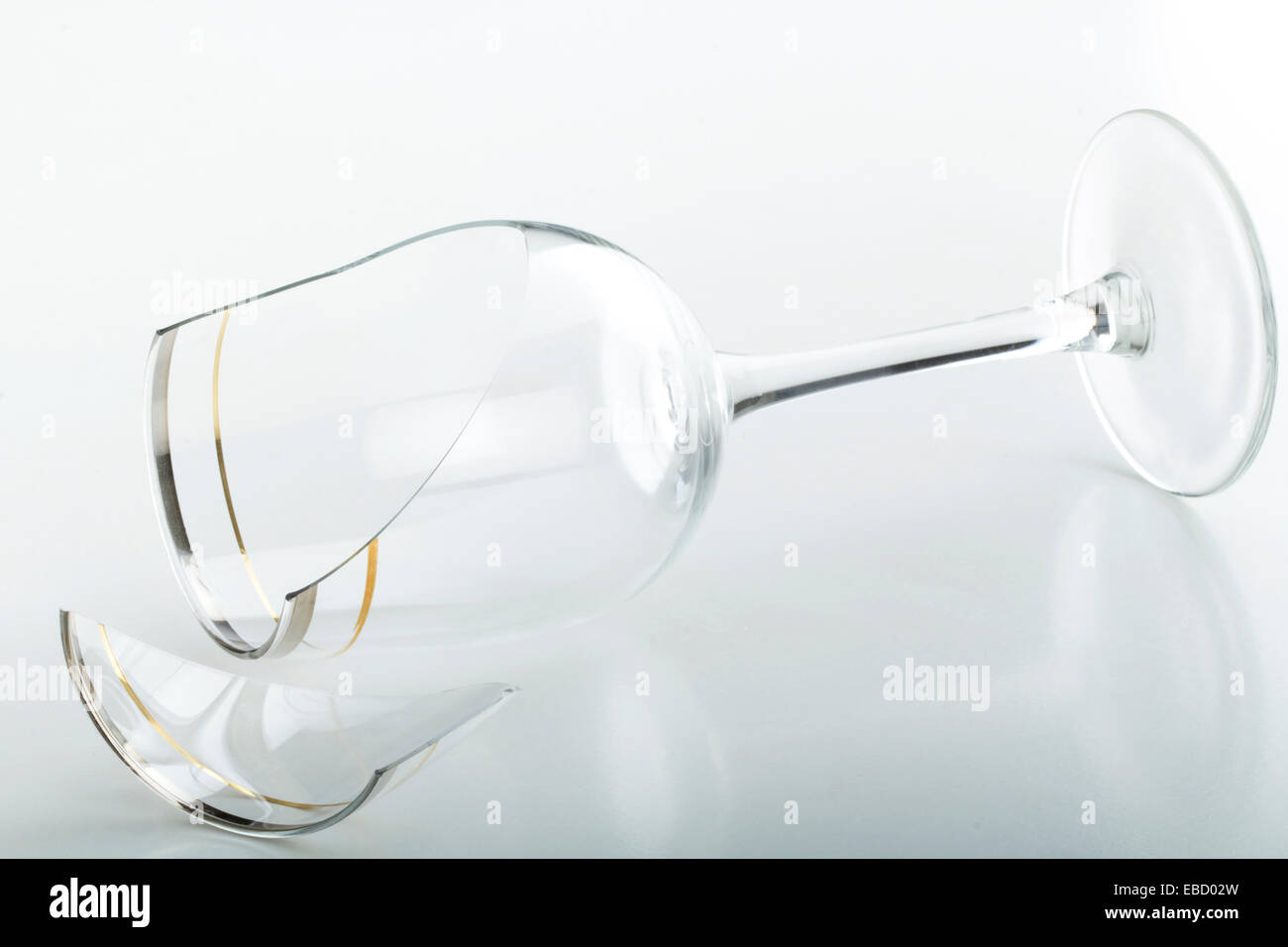 Broken glass over a white background with reflection Stock Photo - Alamy
