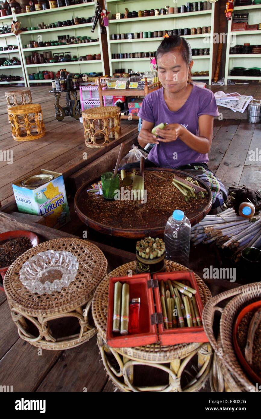 Woman holding cheroot hi-res stock photography and images - Alamy
