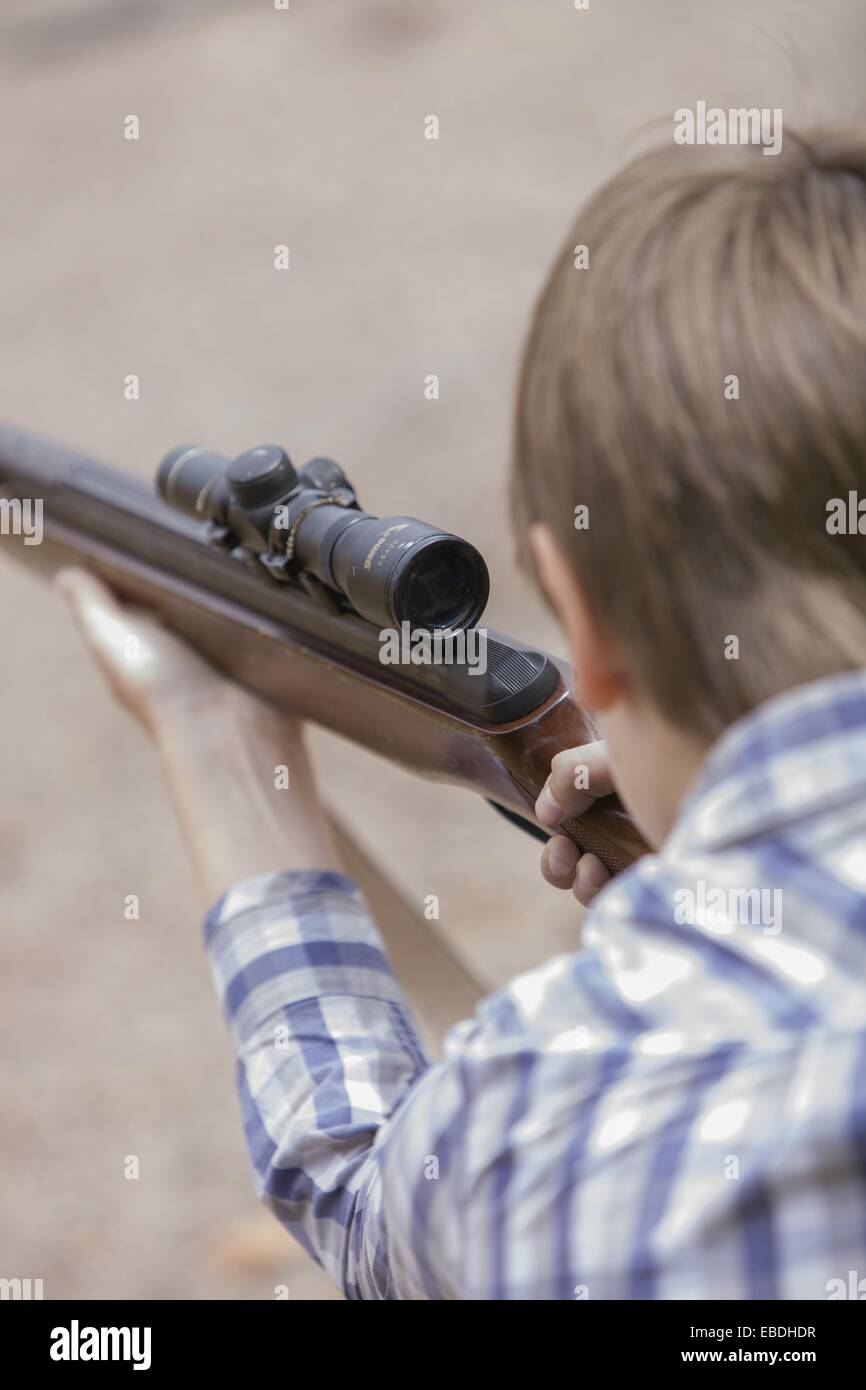 Boy with air gun Stock Photo - Alamy