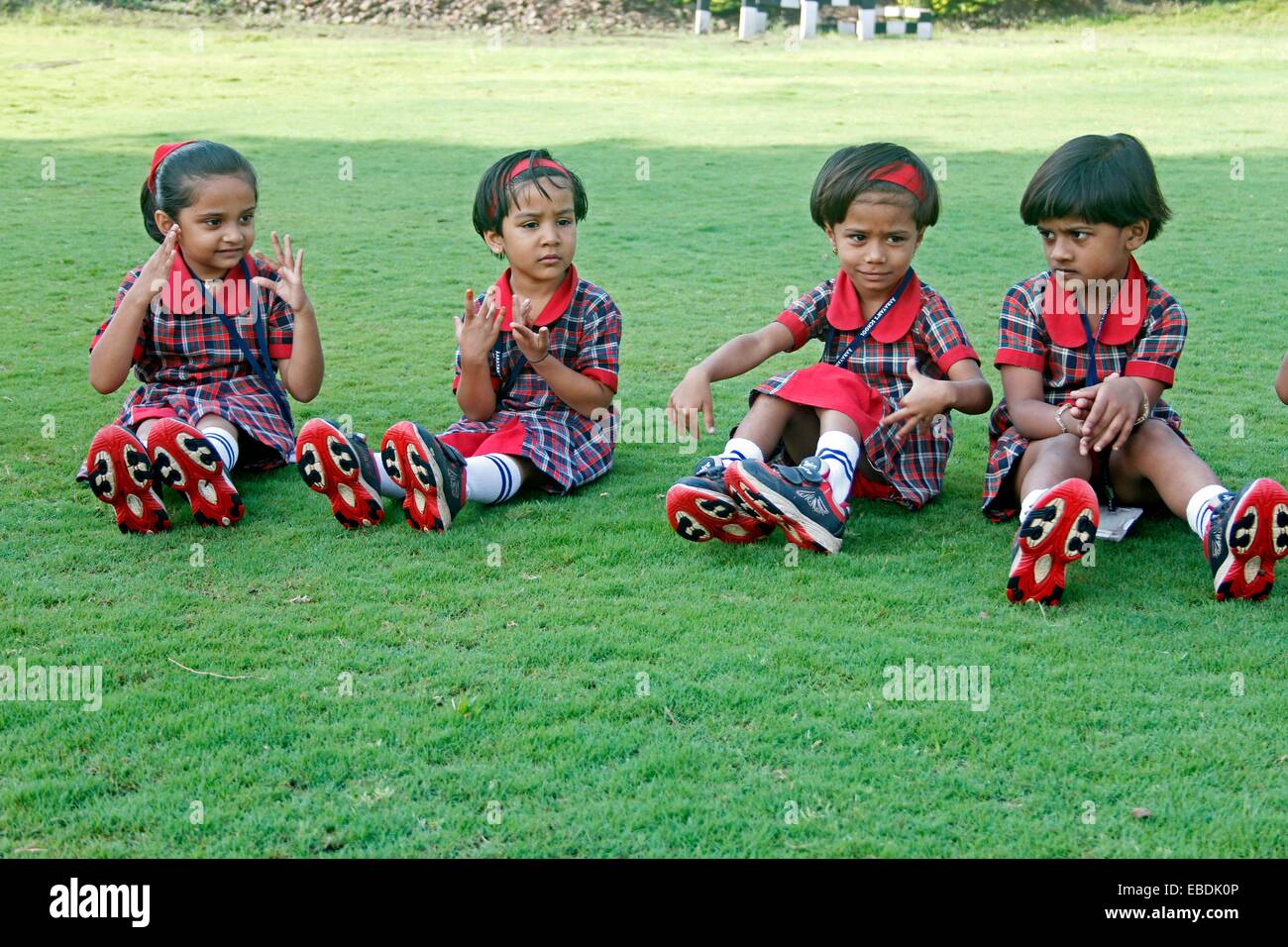 Students sitting on grass with teacher hi-res stock photography and ...