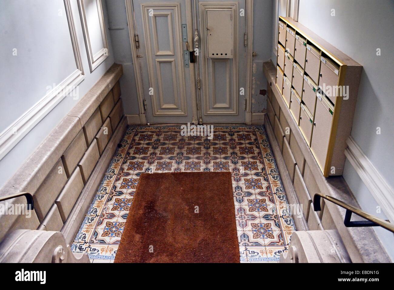 entrance door seen from inside, mail boxes on a side, old tenement ...