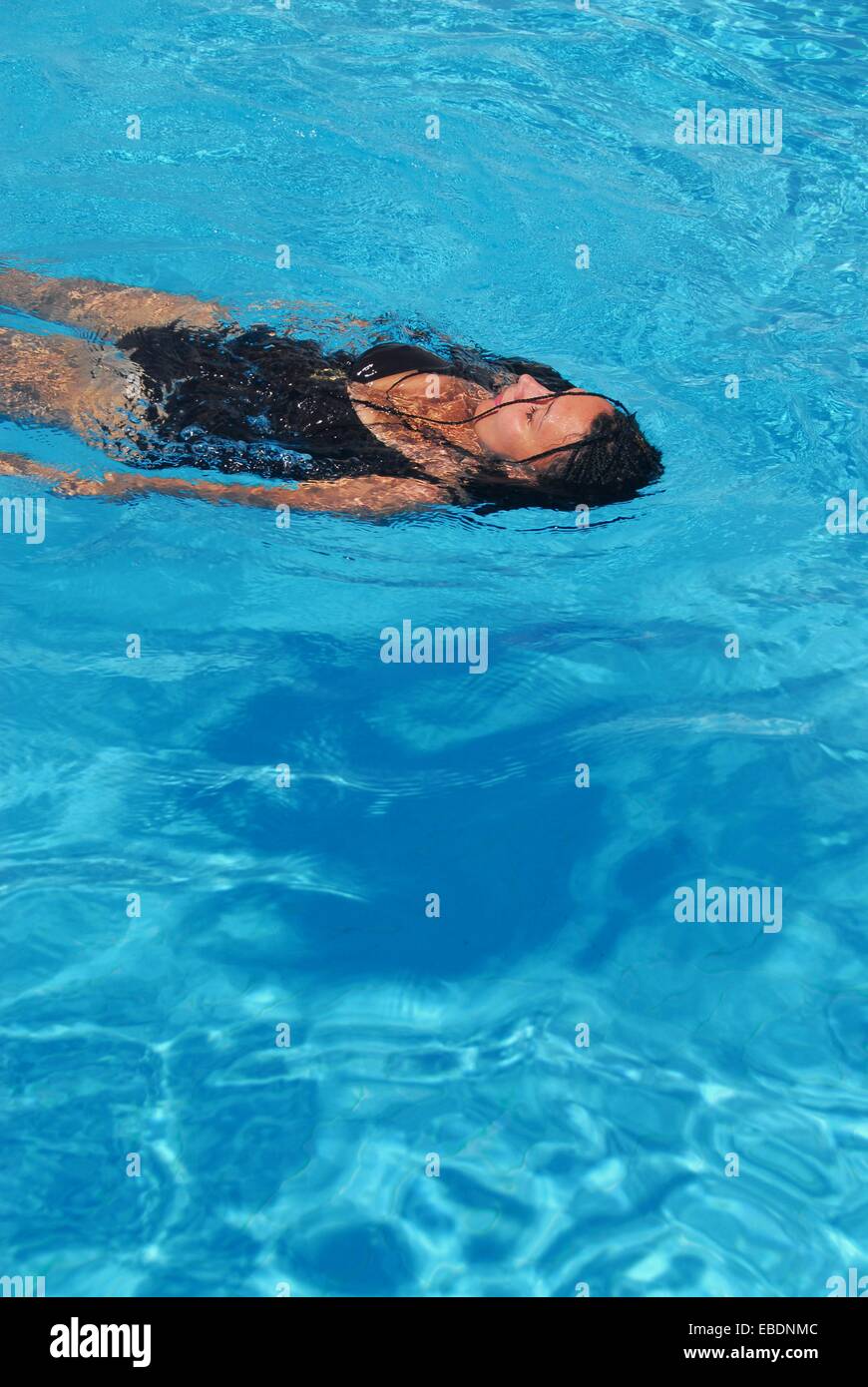 woman resting in swimming pool, summertime Stock Photo - Alamy