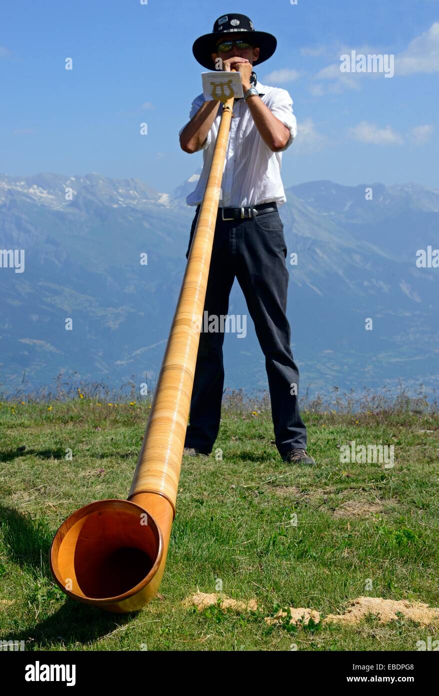 Blowing alpenhorn switzerland hi-res stock photography and images - Alamy