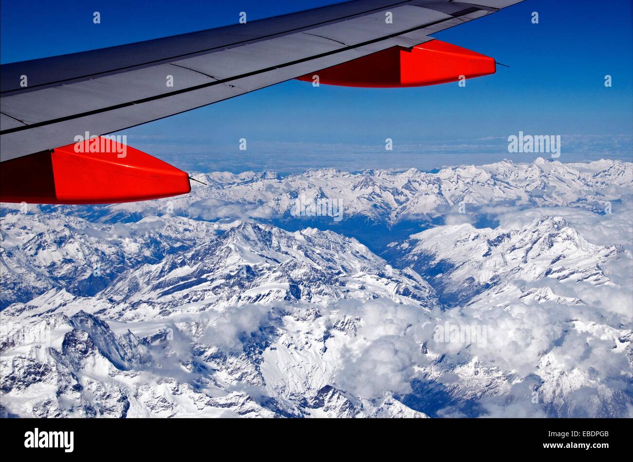 jet plane flying over Swiss Alps Stock Photo - Alamy