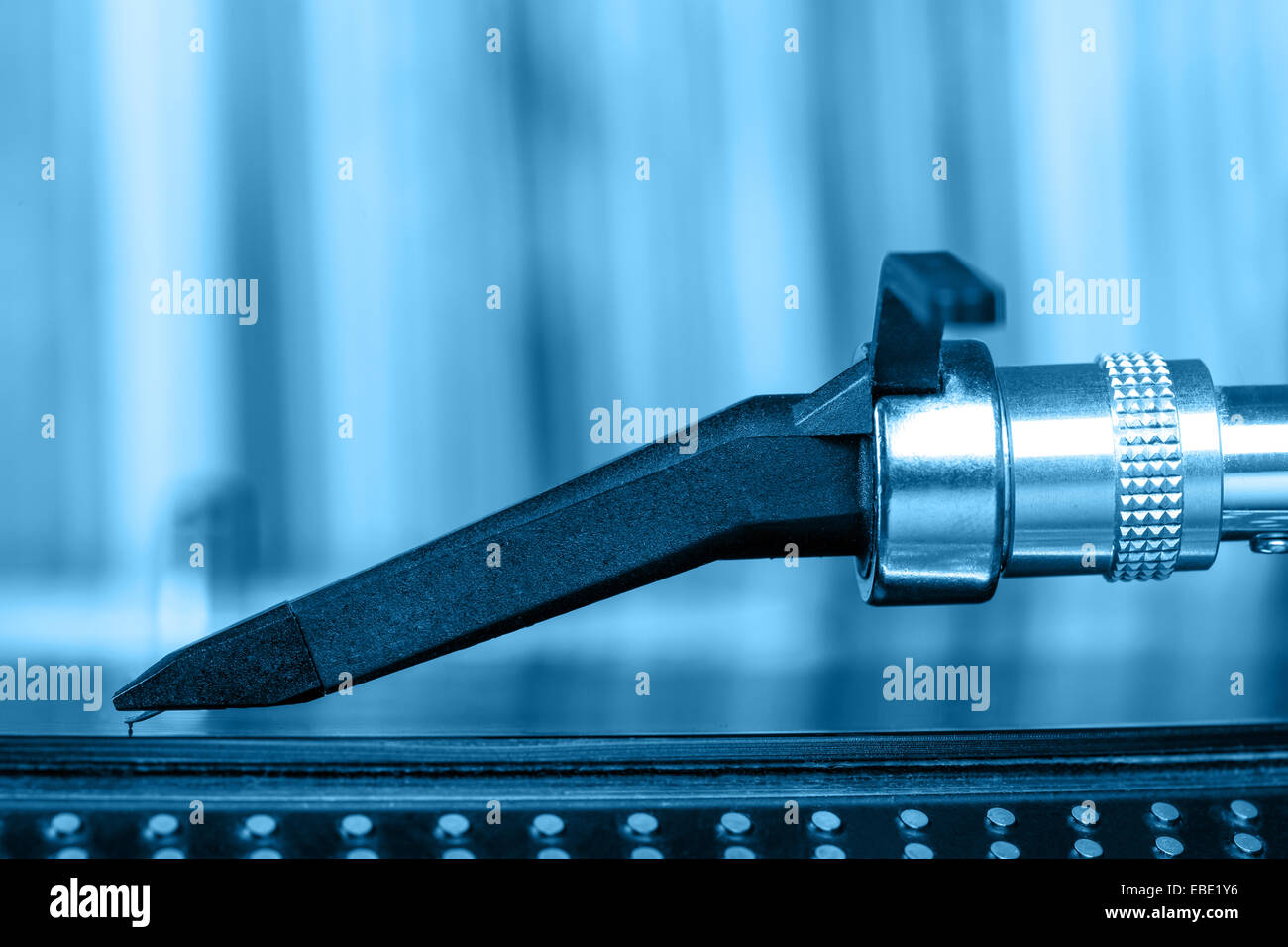 Dj needle stylus on spinning record, vinyl background Stock Photo - Alamy