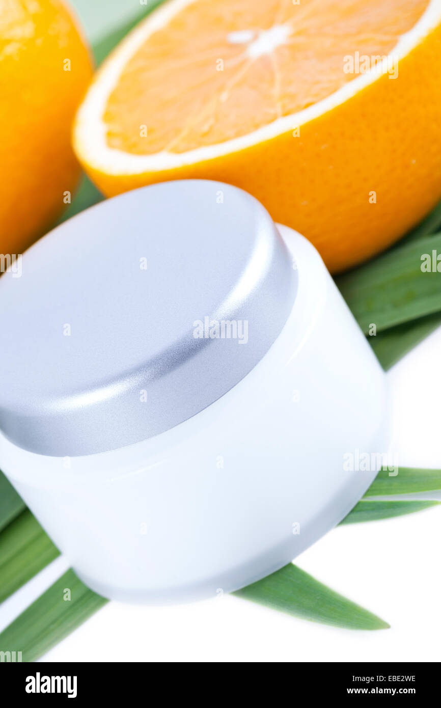 Facial cream with vitamin C, Orange fruit skincare Stock Photo - Alamy