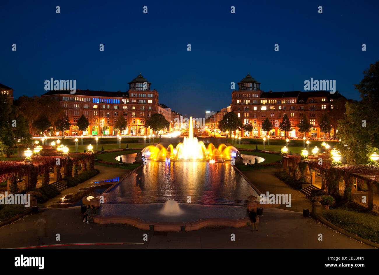 View of Water Fountain at night, with Arcade Buildings in background at ...