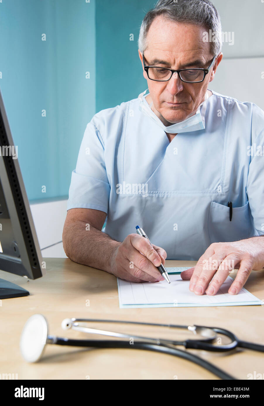Doctor paperwork gp hi-res stock photography and images - Alamy