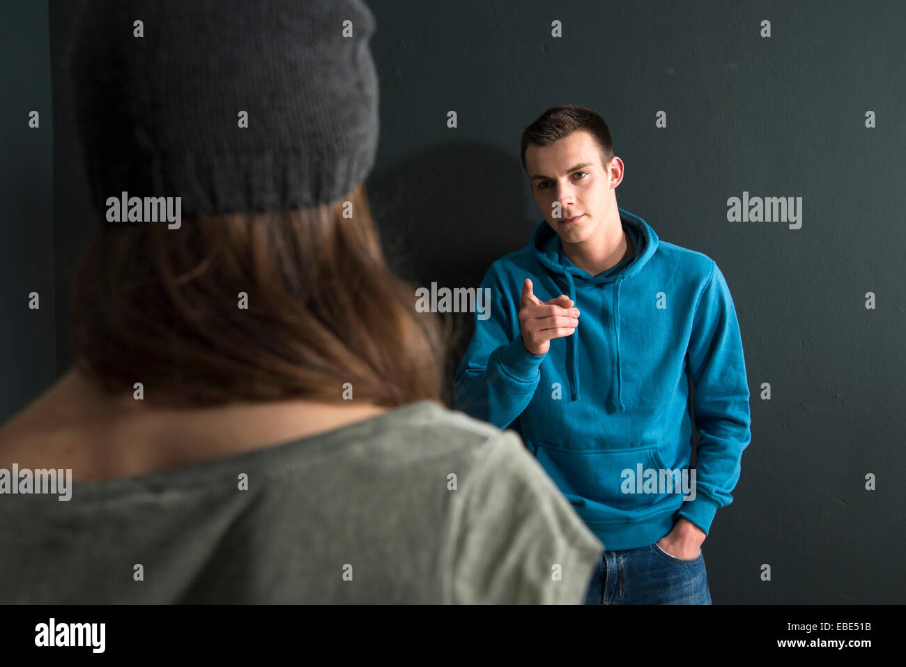 Teenage Girl and Young Man Arguing, Studio Shot Stock Photo - Alamy