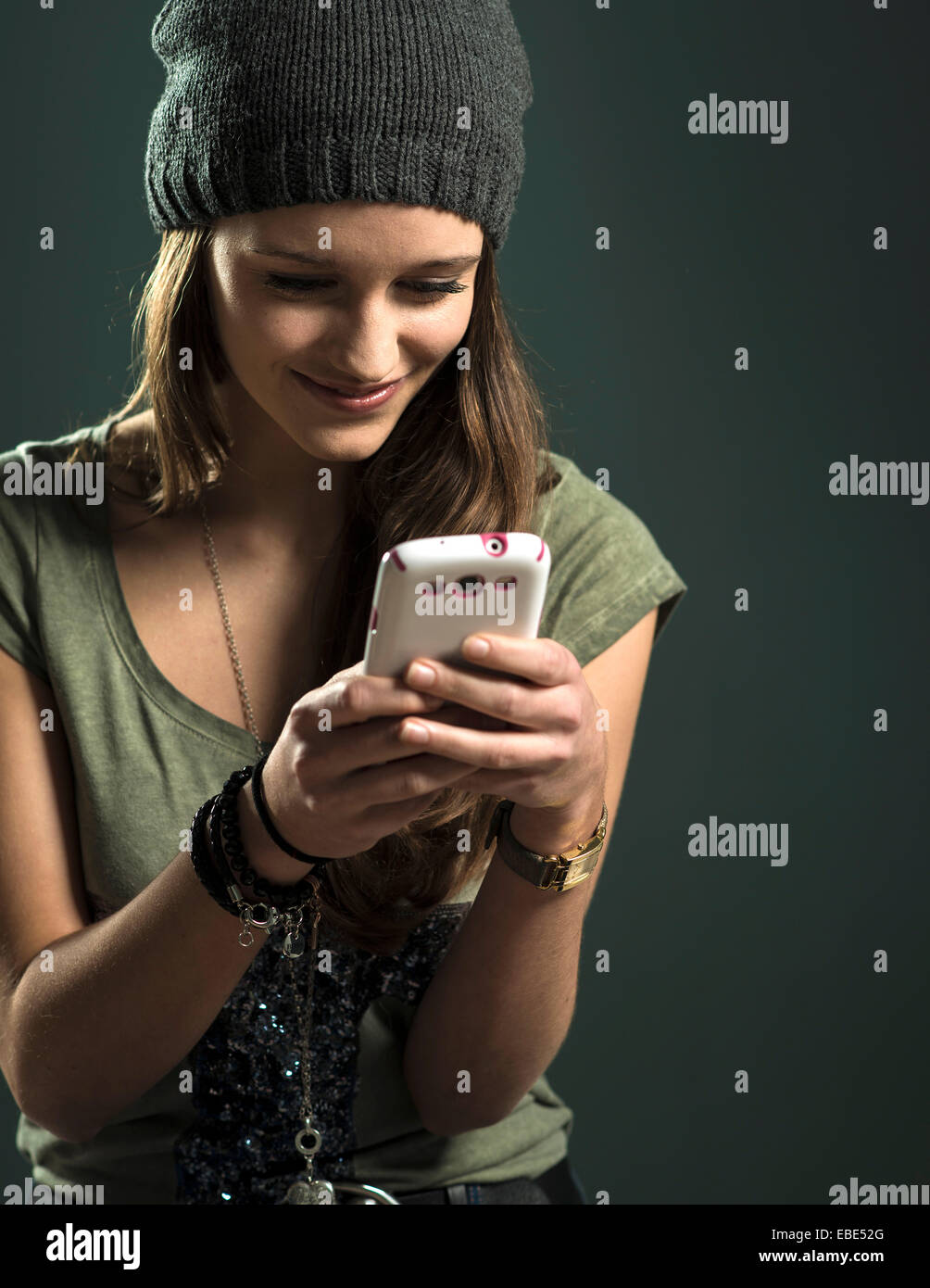Portrait of Teenage Girl using Cell Phone, Studio Shot Stock Photo - Alamy