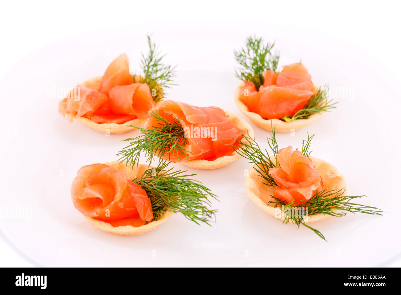 Salmon rolled fillet in pastries on plate Stock Photo - Alamy