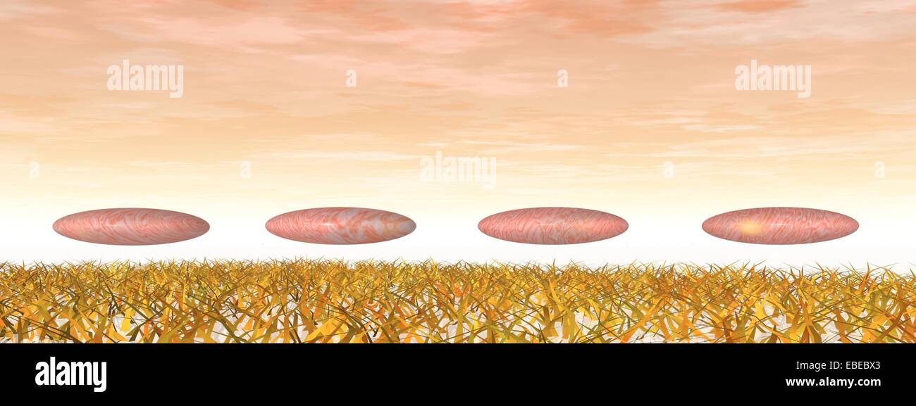 Four pebbles upon grass in pink background Stock Photo - Alamy