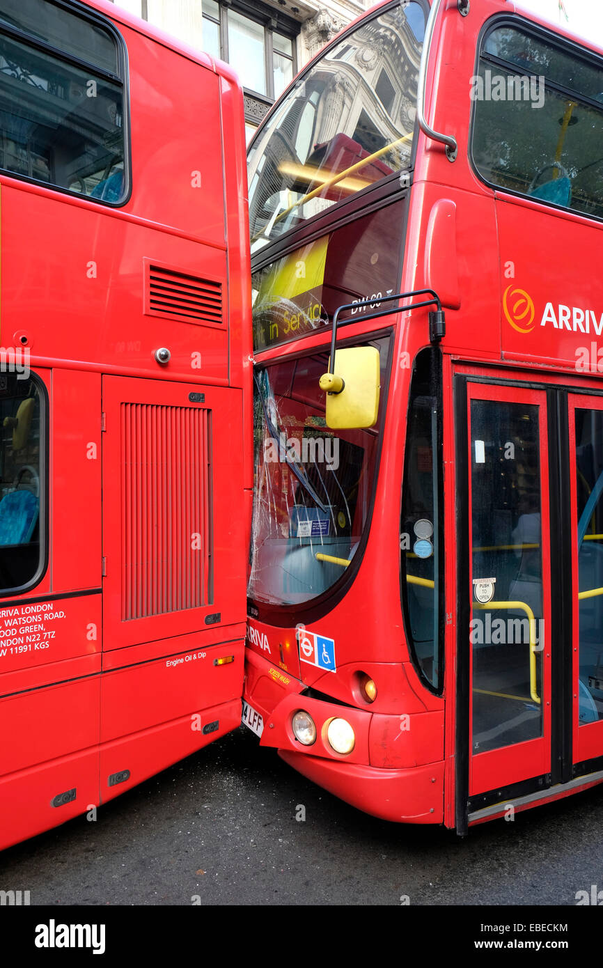Two red double decker buses collide in central London Stock Photo - Alamy