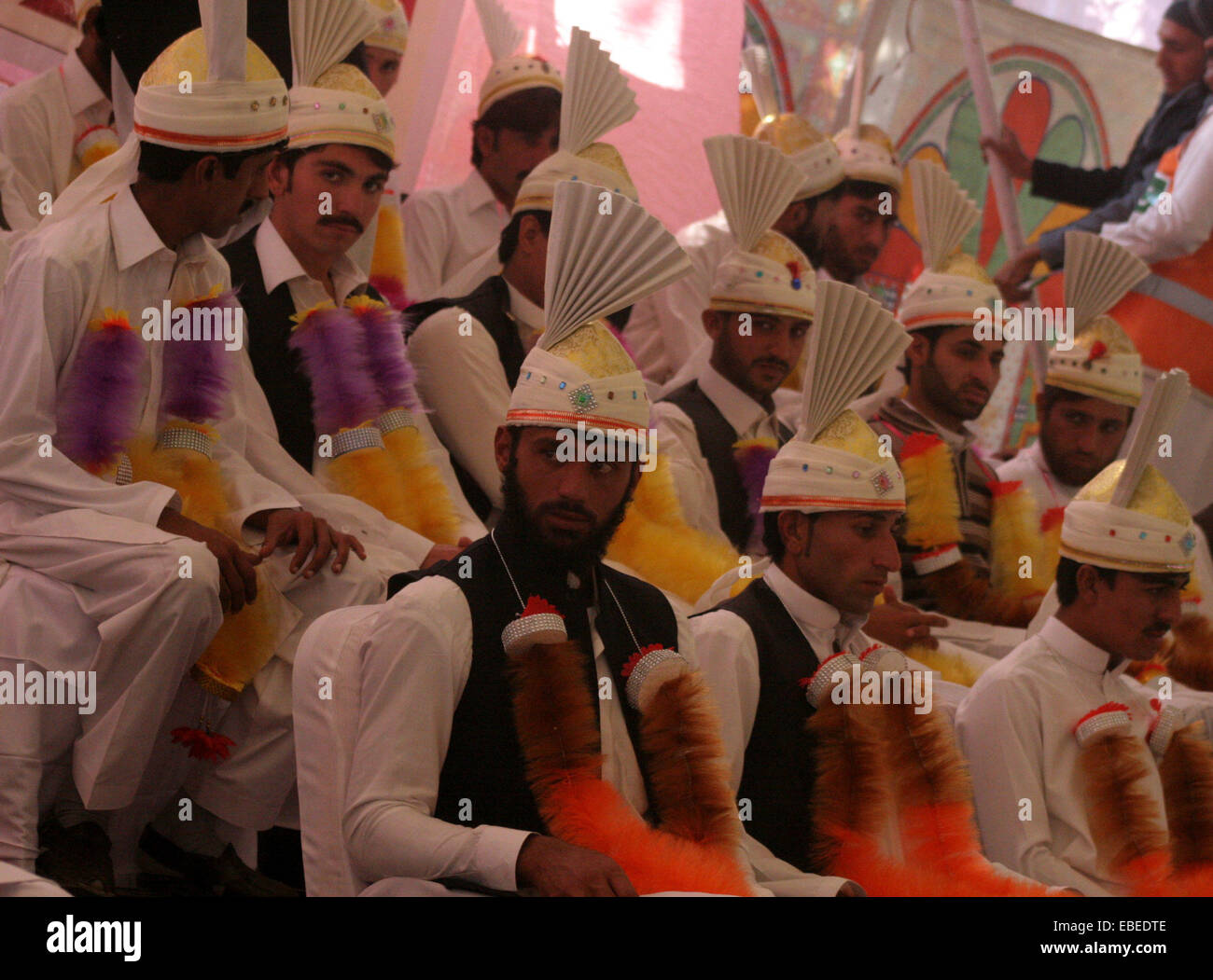 Peshawar. 29th Nov, 2014. Pakistani grooms sit together during a group ...
