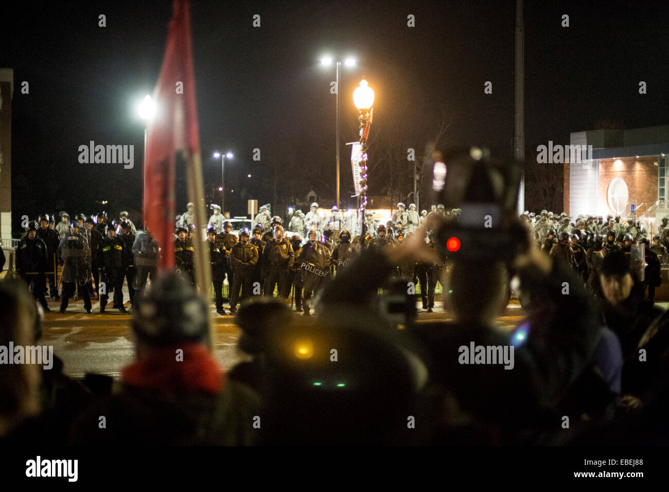 Ferguson, USA. 28th Nov, 2014. Protesters use a loud speaker to chant ...