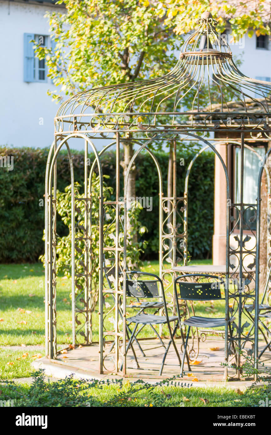 beautiful open and empty metal arbor in a garden Stock Photo - Alamy