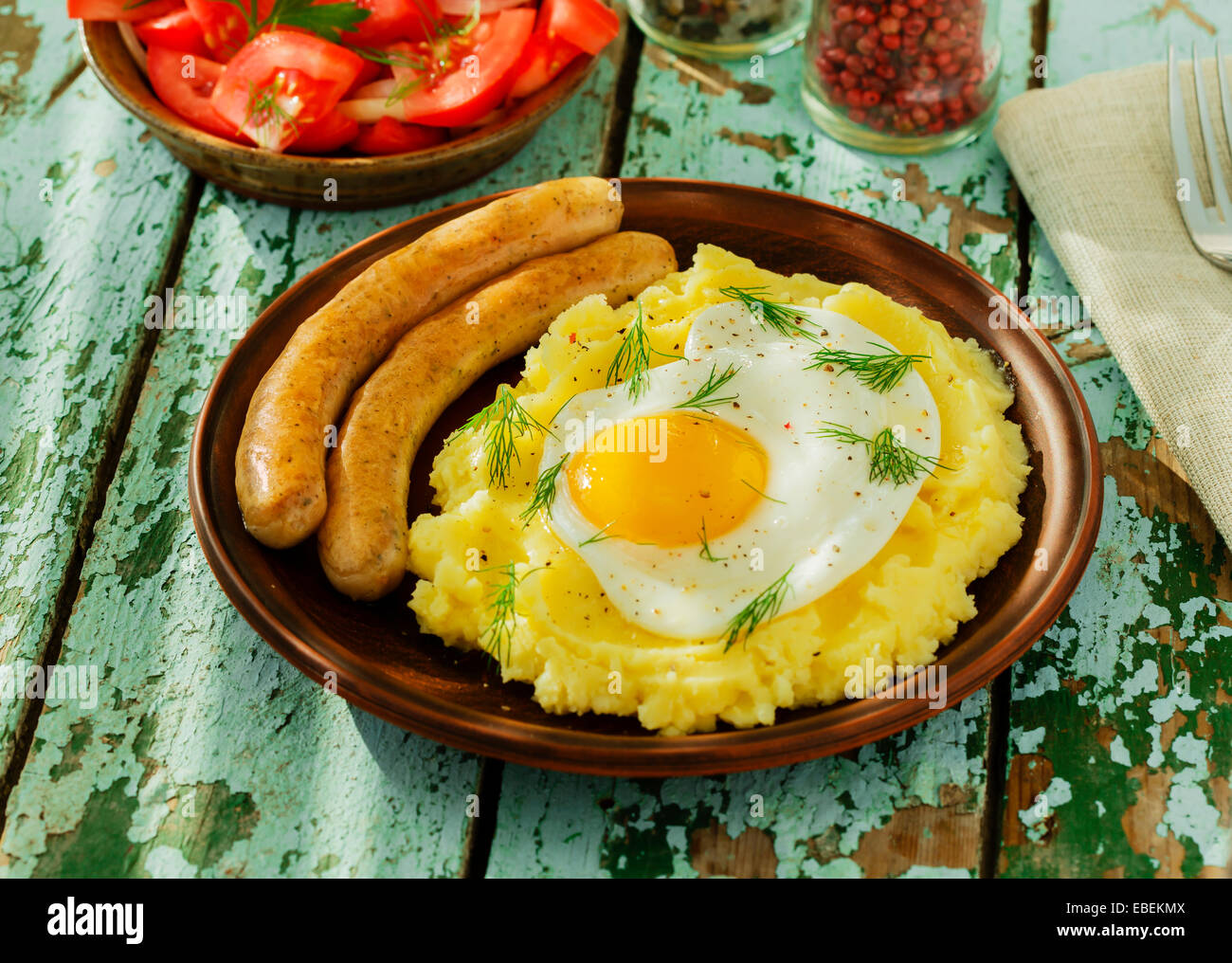 mashed potatoes with fried egg and sausage Stock Photo - Alamy