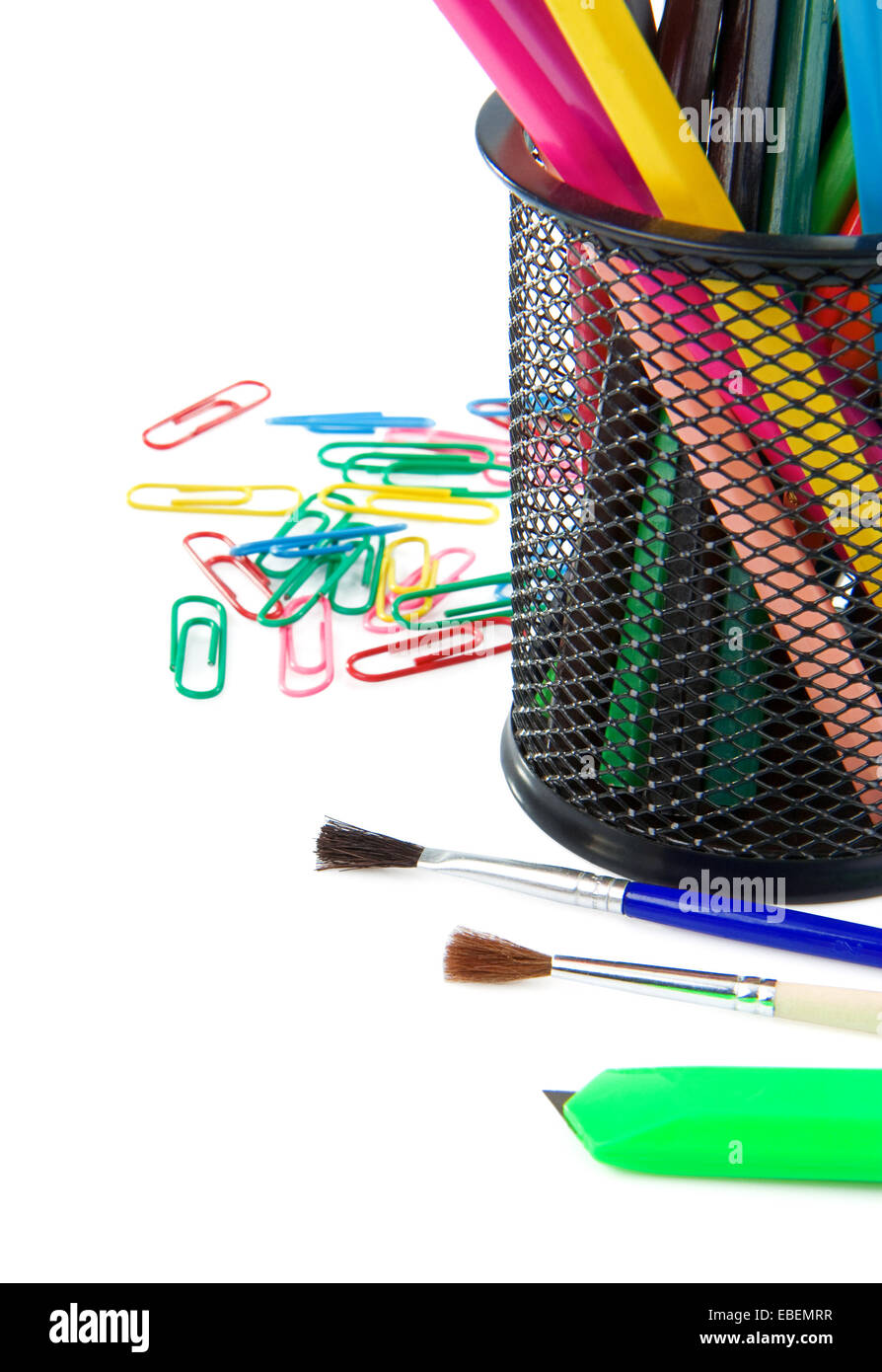 paintbrush, paper clips and pencil in holder isolated on white ...