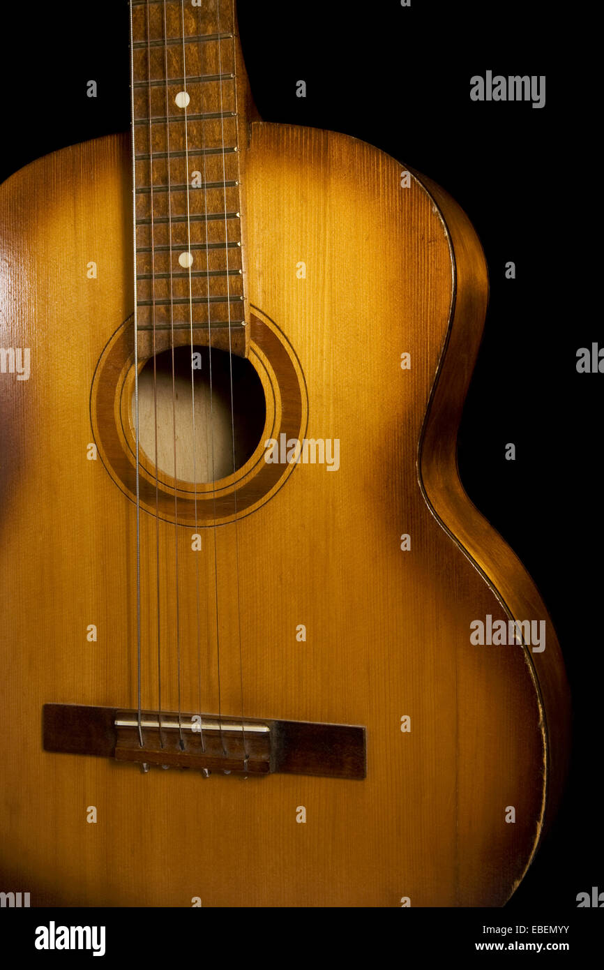 classical wooden guitar on black background Stock Photo - Alamy