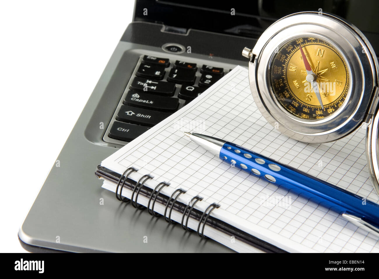 notebook laptop, compass and blue pen isolated on white background ...