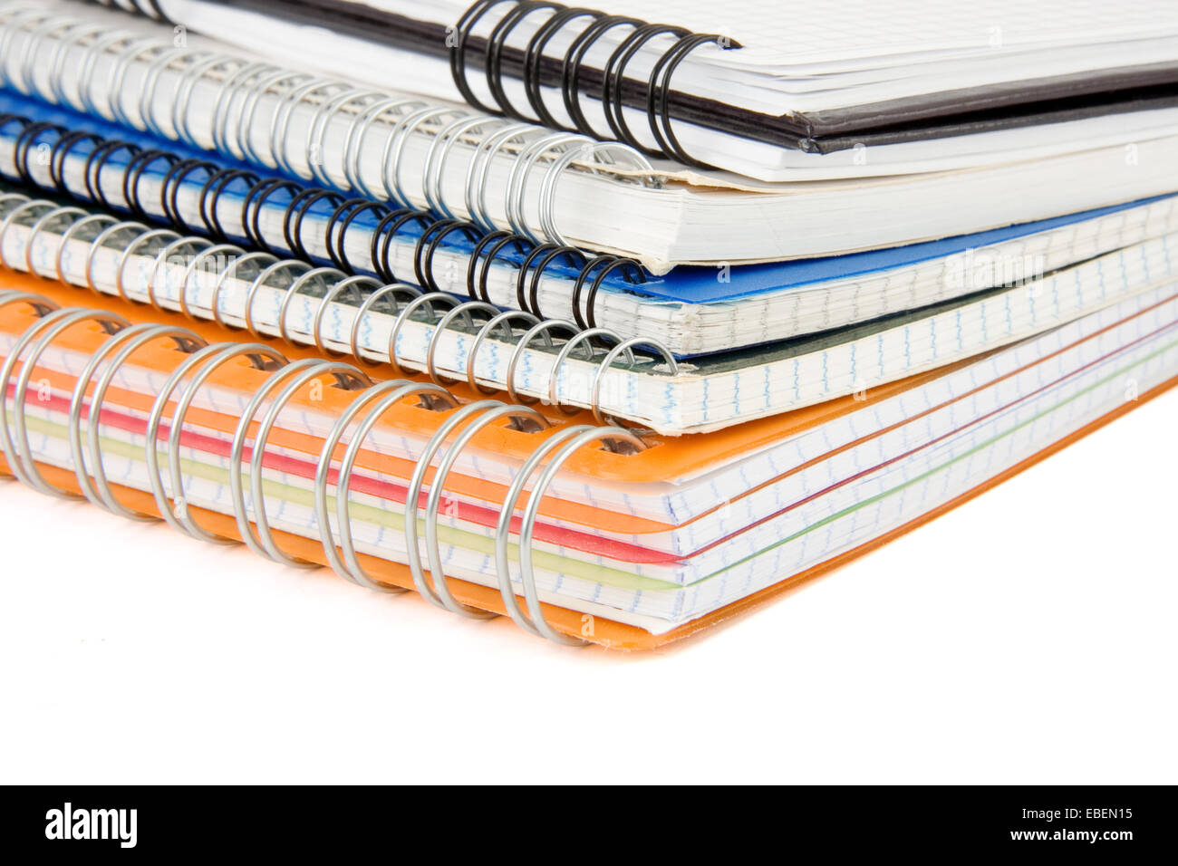 pile of checked notebook isolated on white background Stock Photo - Alamy