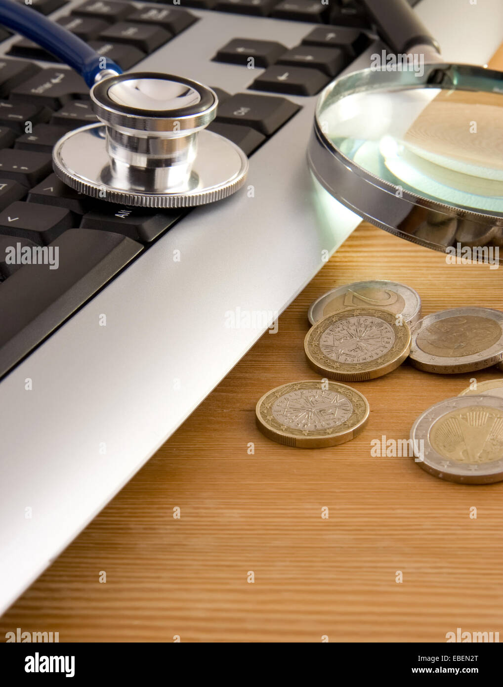 medical stethoscope and magnifying glass on keyboard Stock Photo - Alamy