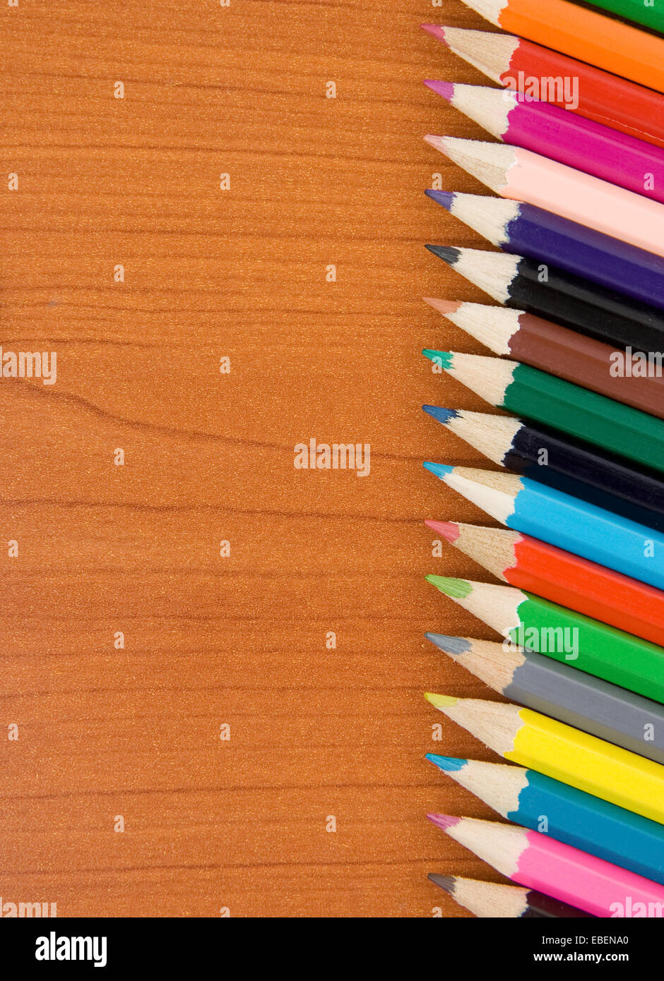 colorful pencils on wood texture Stock Photo - Alamy