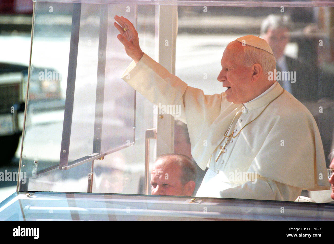Pope John Paul II waves from inside the popemobile during his visit ...
