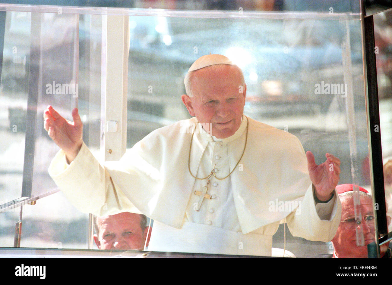Pope John Paul II waves from inside the popemobile during his visit ...