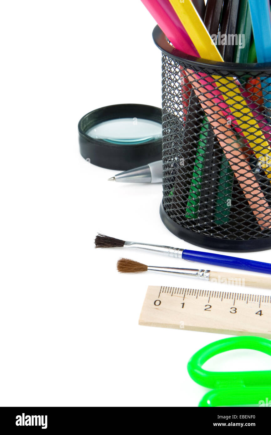 paintbrush, magnifier and pencils in holder isolated on white ...