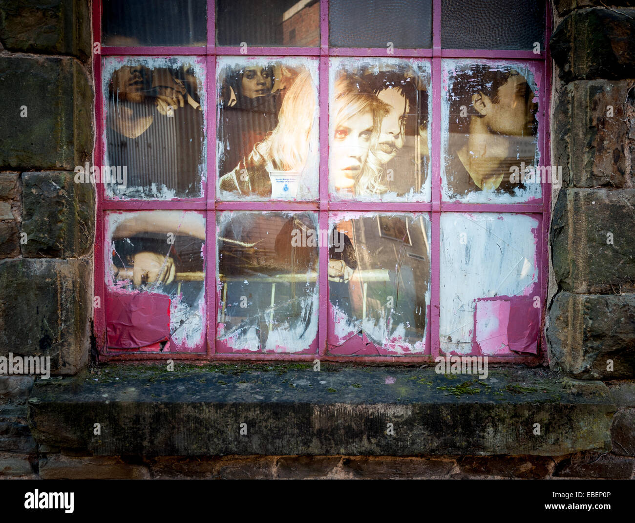 A poster inside the window of a Cardiff workshop Stock Photo - Alamy