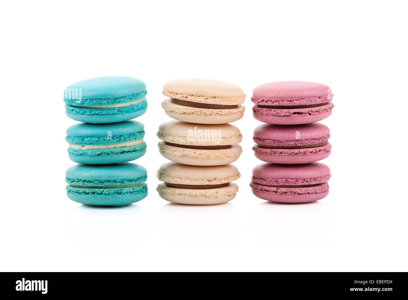 Three stacks of multicolored macaroons isolated on white background ...