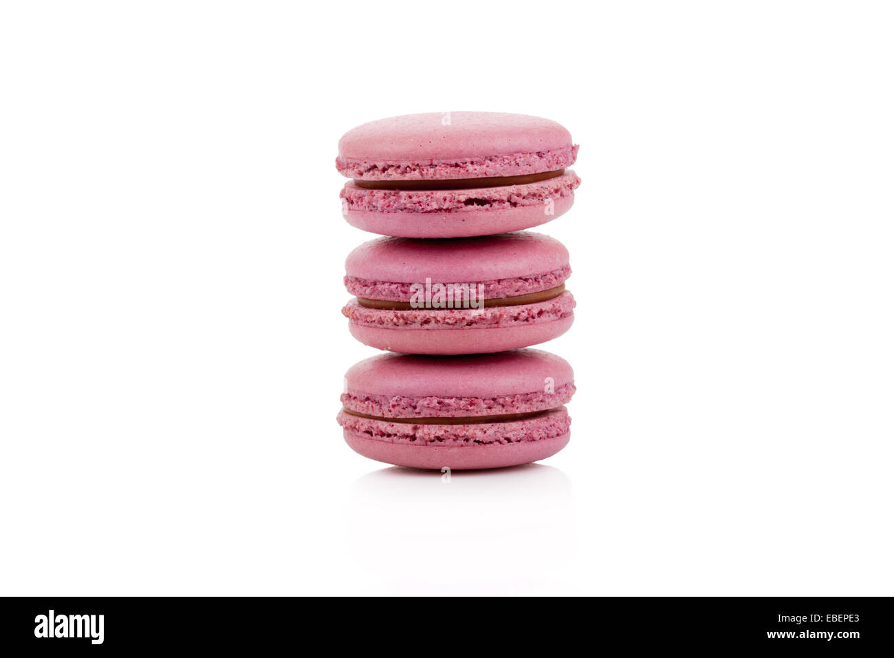 Three red colored macaroons isolated on white background Stock Photo ...