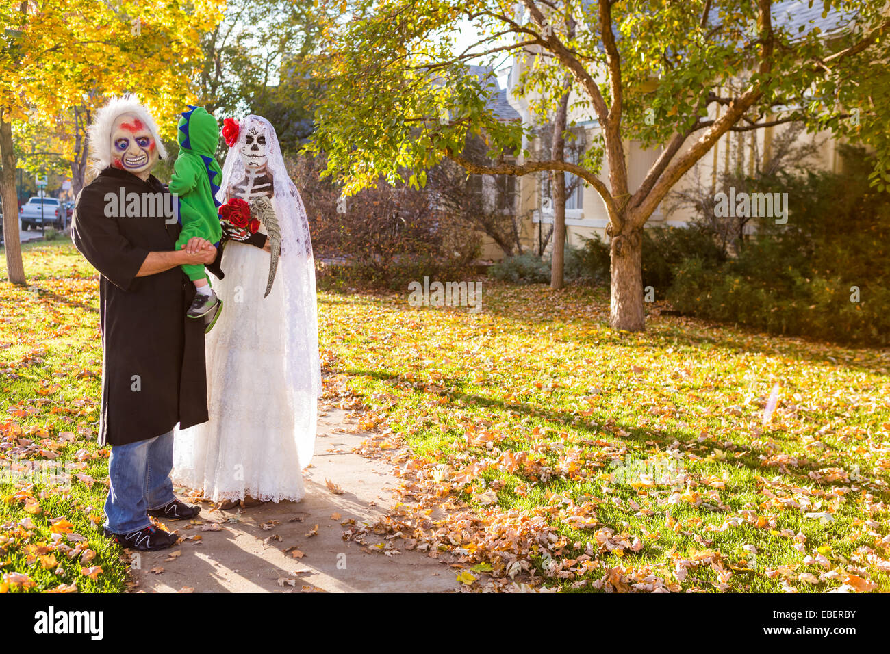 Trick or treating in costumes on Halloween night Stock Photo - Alamy