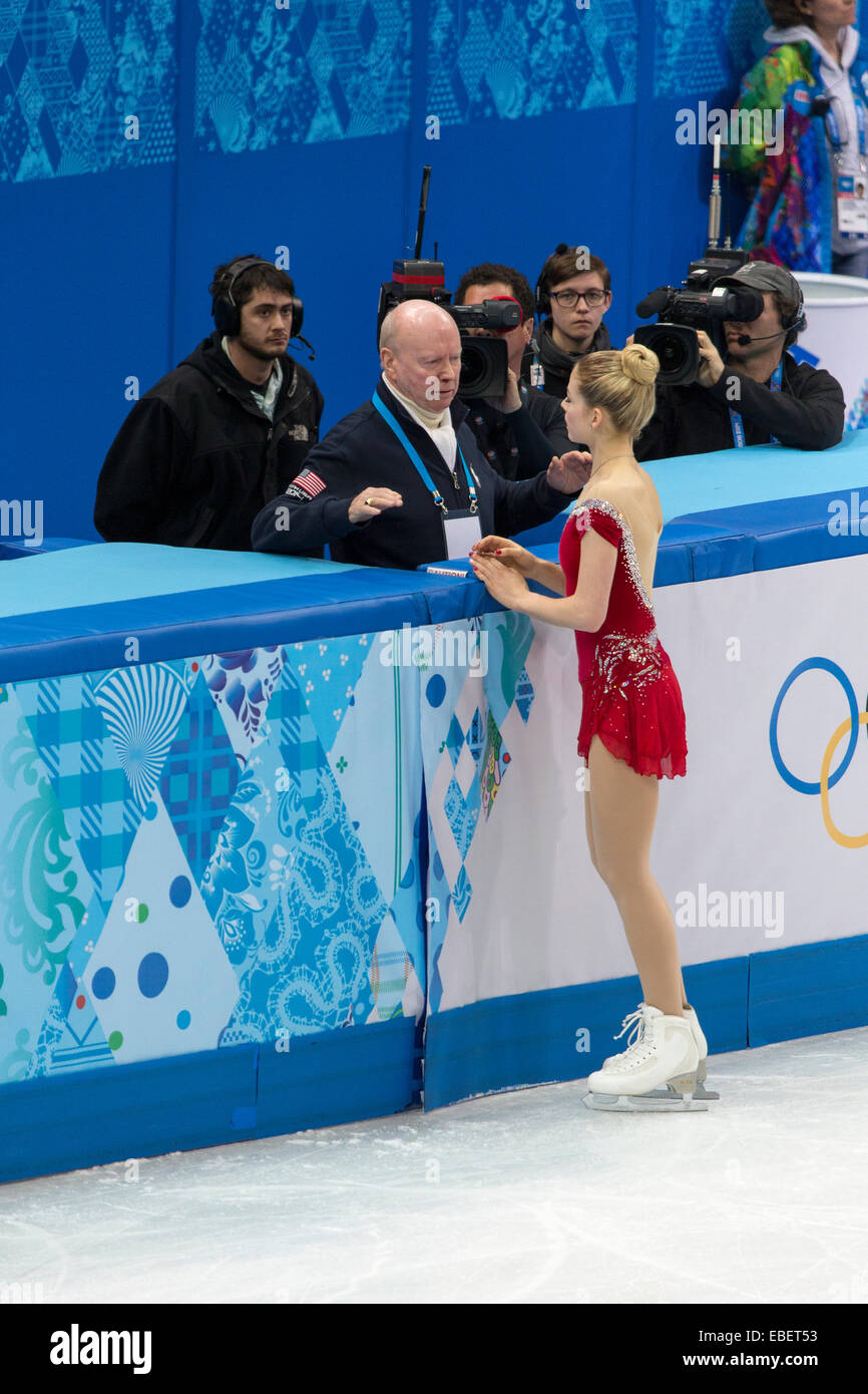 Gracie Gold (USA) with coach Frank Carroll before competing in the ...