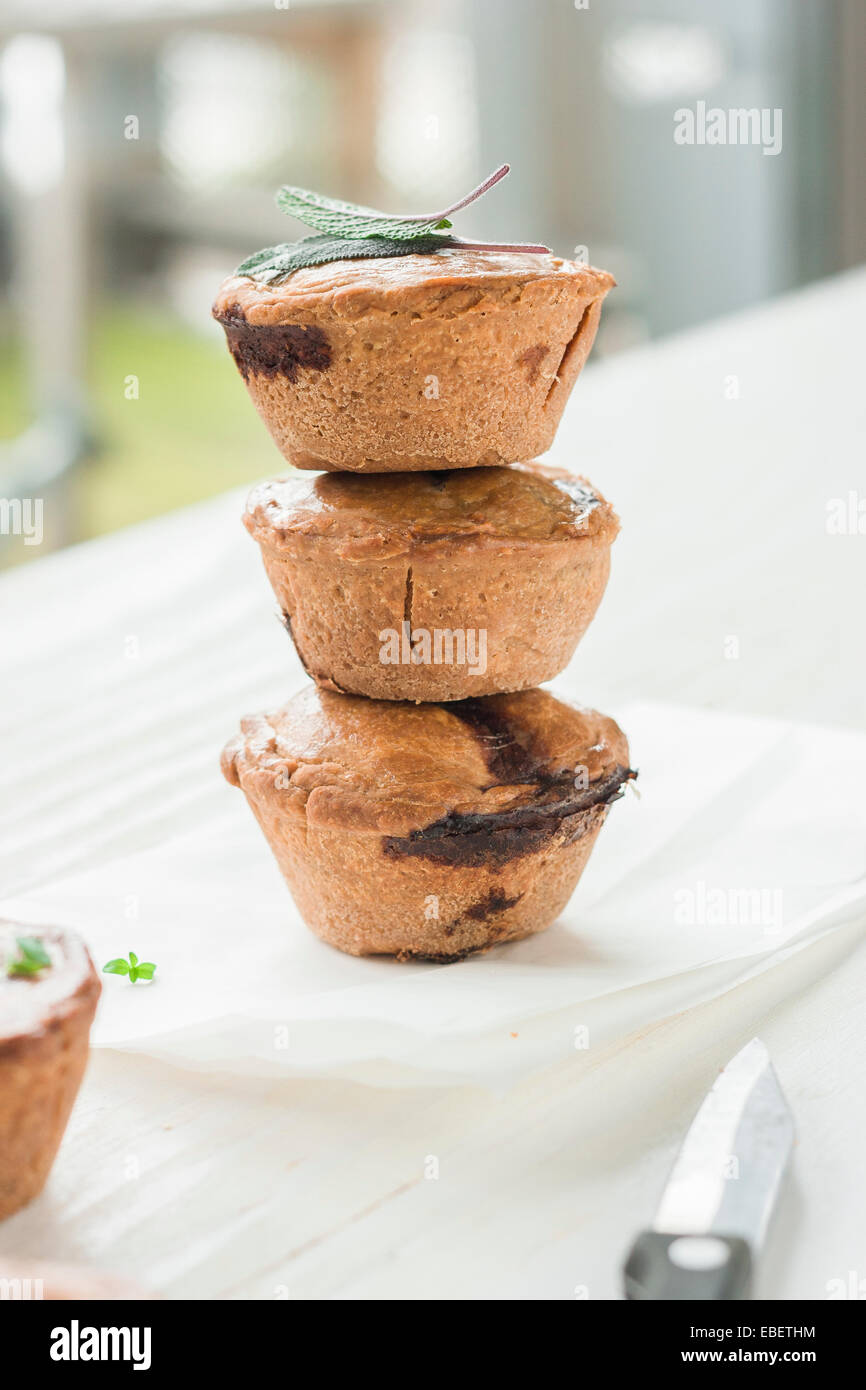 Tower of three mini pork pies. Traditionally British recipe for Summer ...