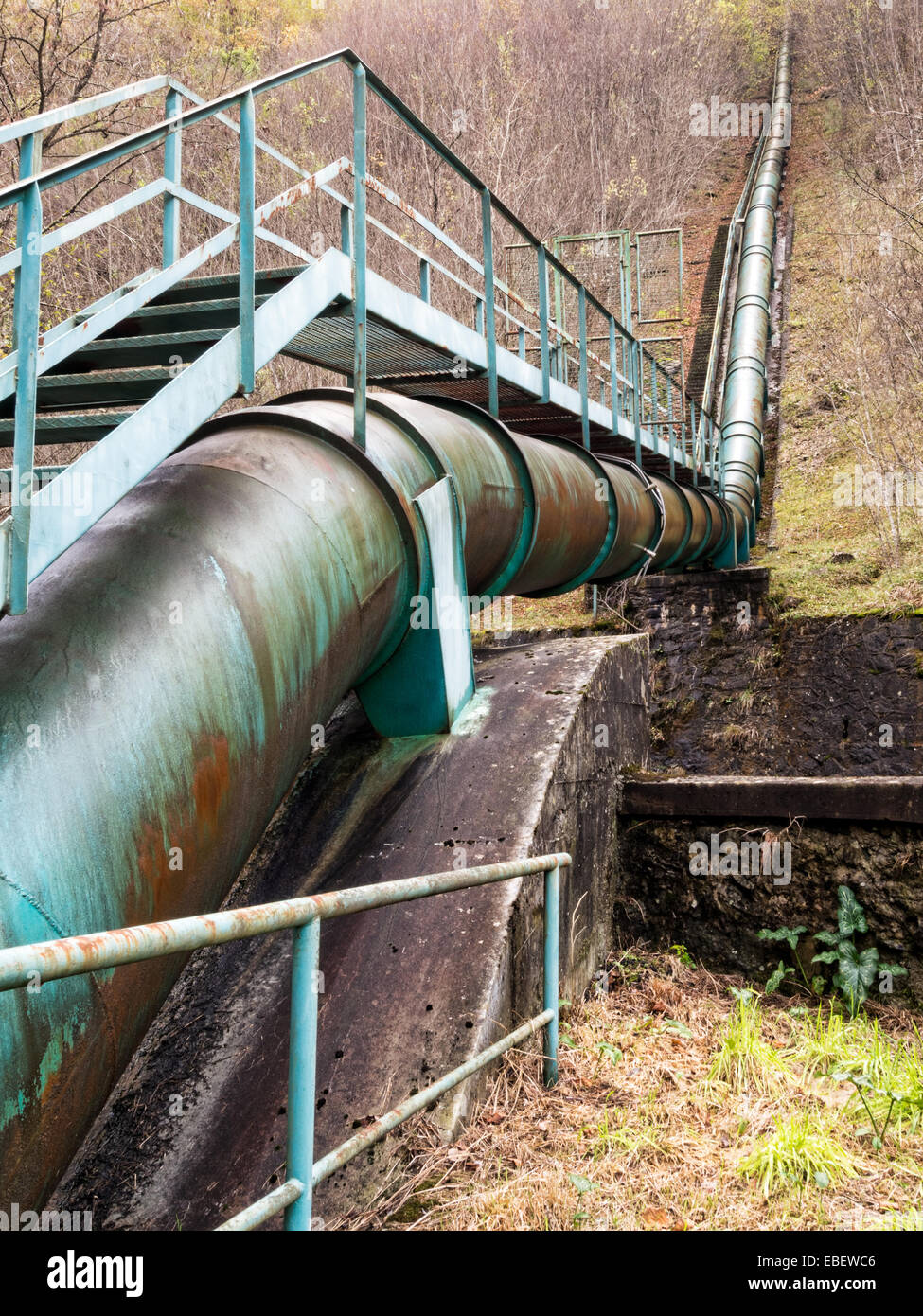 Green energy. Water pipe takes water from mountain to small local power ...