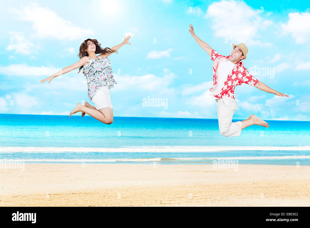 indian married couple Beach Jumping Stock Photo - Alamy