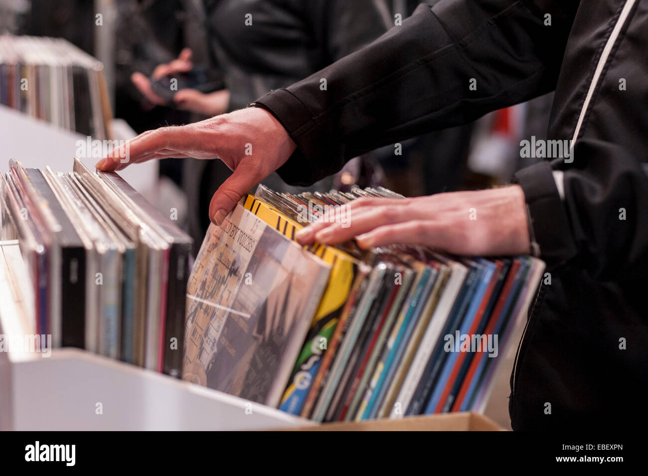 London, UK. 29th November, 2014. A man thumbs through a stack of LPs as ...