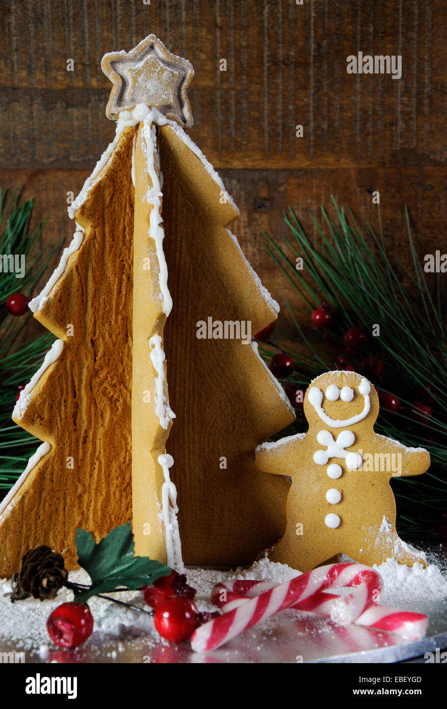 Christmas holiday gingerbread man and tree against dark wood rustic ...