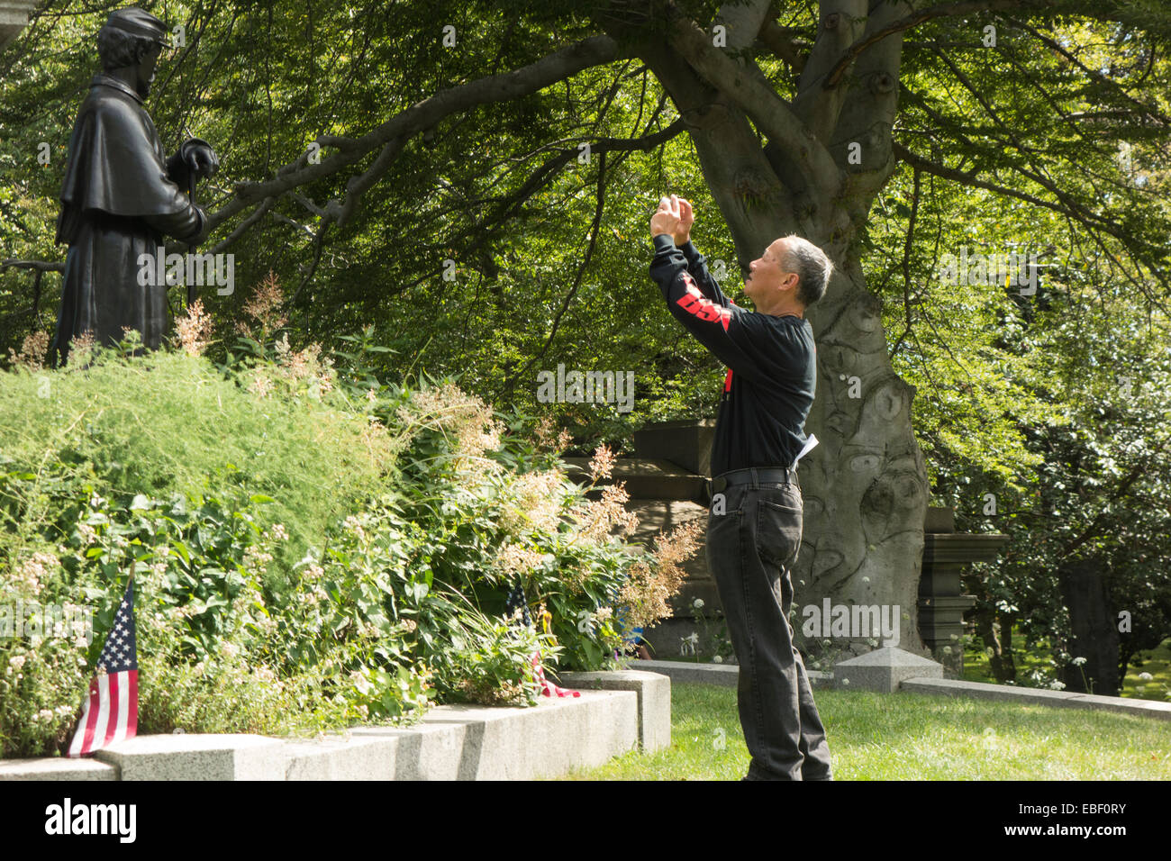 photographer taking photos in Greenwood cemetery Stock Photo - Alamy