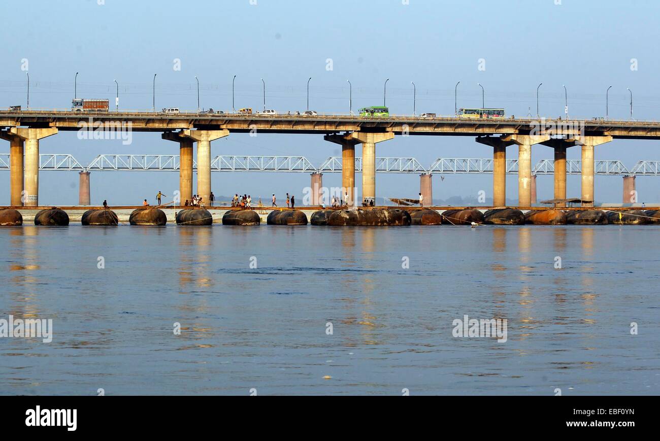 Laborers construct temporary pontoon bridge at the river Ganga before ...
