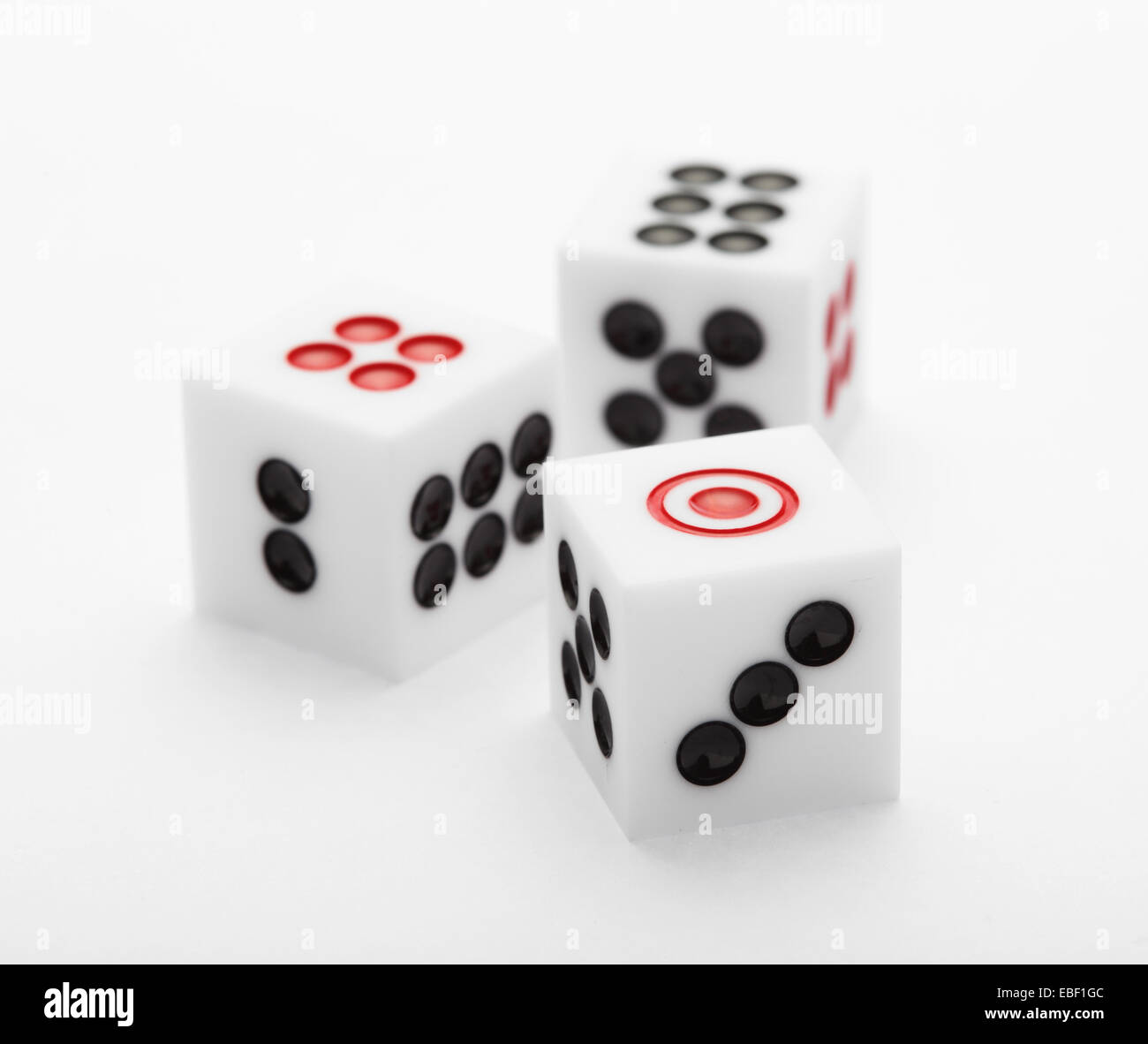 Three dice on table for game set Stock Photo - Alamy