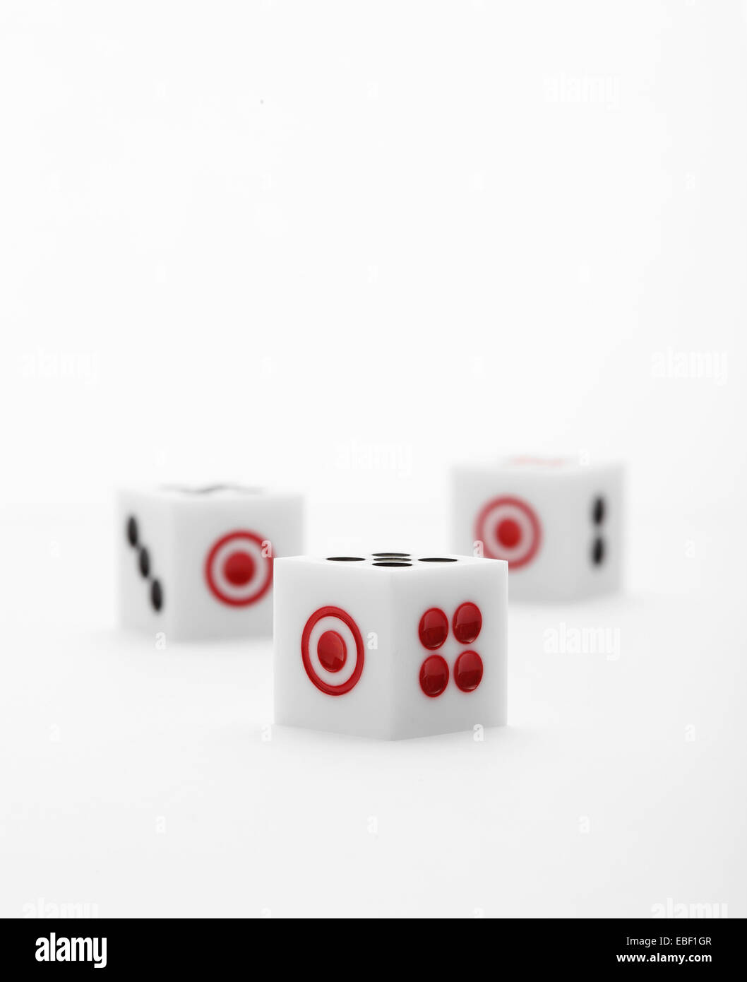Three dice on table for game set Stock Photo - Alamy