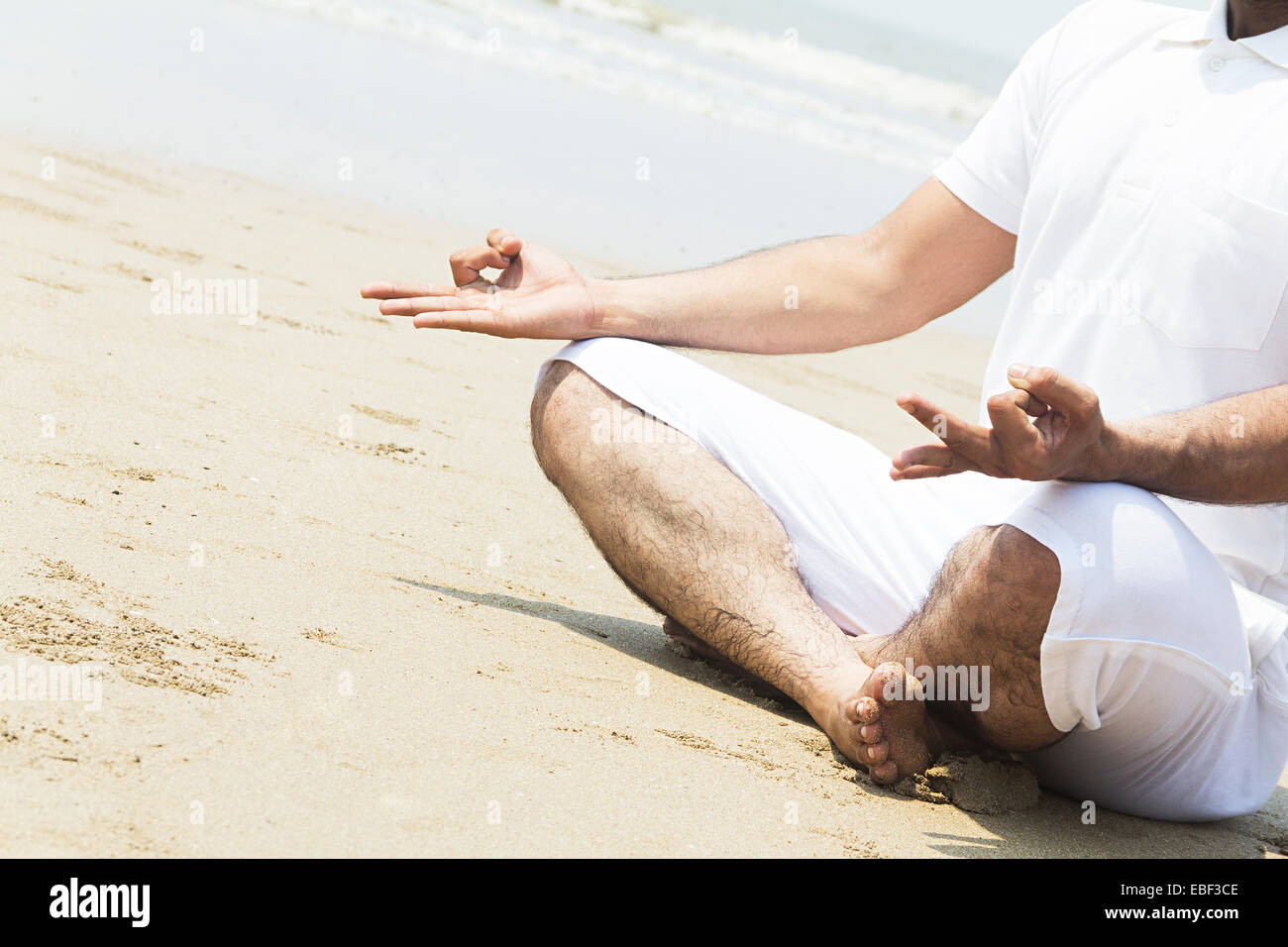 Indian man beach yoga hi-res stock photography and images - Alamy
